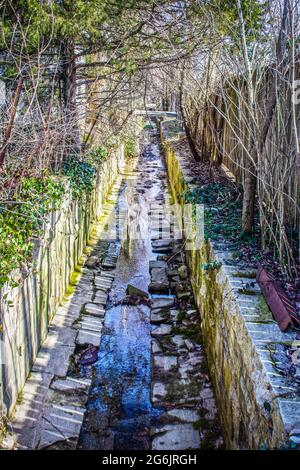 Channel of sewage urban storm water Stock Photo - Alamy