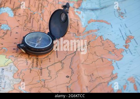Old compass on the Russian-language map of the world. Concept Stock ...