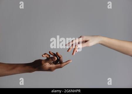 Two male hands reaching out angrily to grab something, white background ...