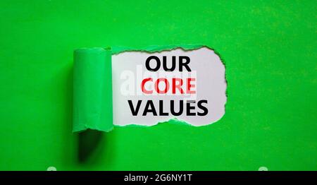 Our core values symbol. Words 'Our core values' appearing behind torn ...