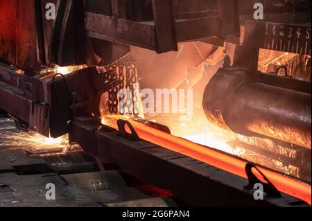 The process of rolling hot rolled steel in a rolling mill Stock Photo ...