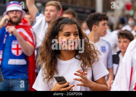 An England fan is all smiles as she arrives at Wembley Stadium ahead of ...