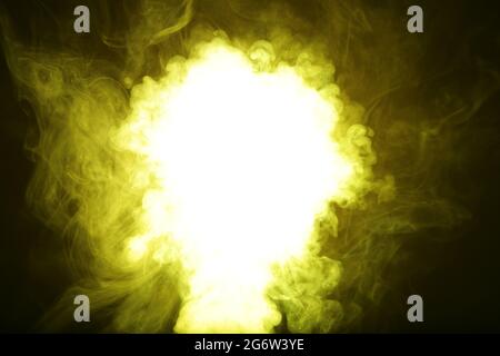 Artificial yellow light illuminates smoke on dark background Stock ...