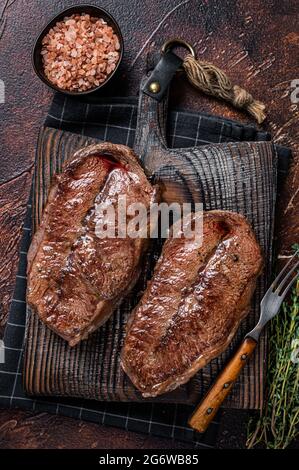Roasted Shoulder Top Blade or flat iron beef meat steaks on wooden ...