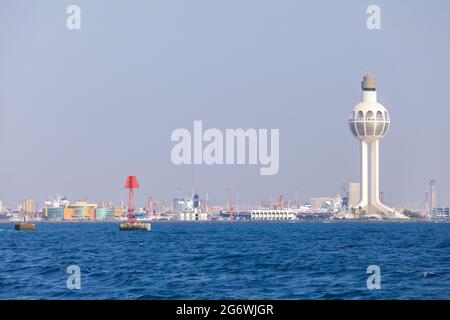 Skyline of Jeddah Islamic Seaport with white traffic control tower ...