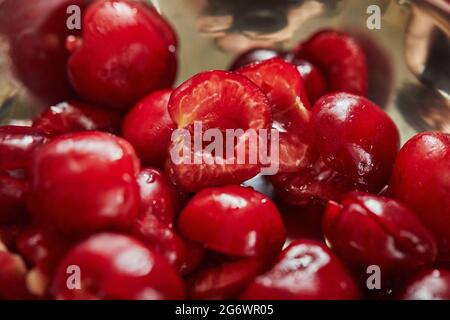 Pitted cherries are ready in pie bowl. Step by step recipe Stock Photo ...