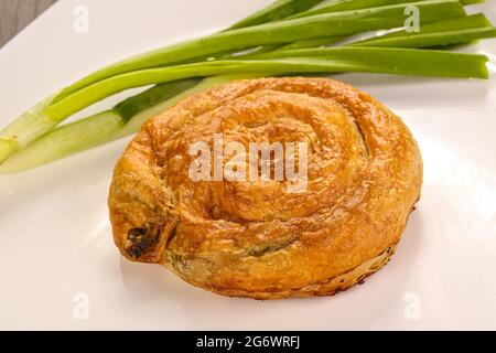 Paff pastry snail with meat served onion Stock Photo - Alamy