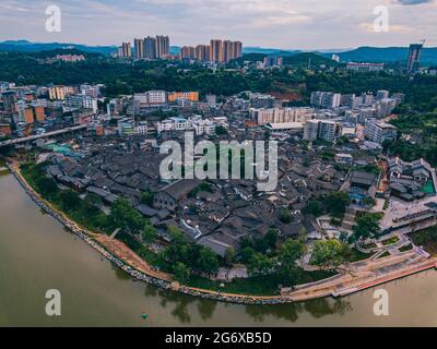LANGZHONG ANCIENT CITY (SICHUAN), CHINA: A Mickey Mouse actor adds a ...