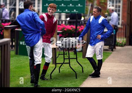 Jockeys Jim Crowley and David Egan head in to the parade ring on Day 1 of the Qatar Goodwood ...