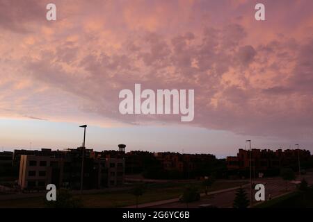 Sunset with extreme colours and urban silhouette Stock Photo - Alamy