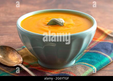 Healthy Sweet Potato and Sage Soup on a Rustic Wooden Table Stock Photo ...