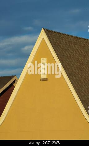 Rooftop with an attic window under blue sky Stock Photo - Alamy