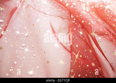 Red organza background with stars on it Stock Photo - Alamy