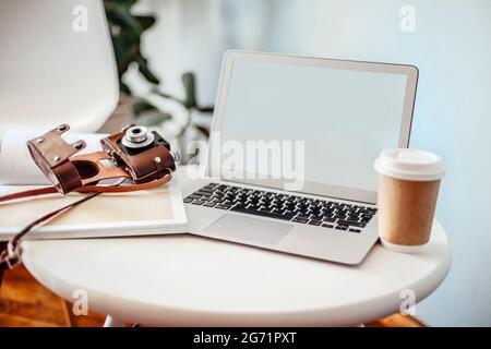 Blank magazine and cup of tea on light background Stock Photo - Alamy