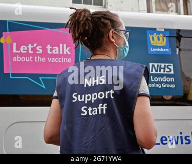 A mobile NHS vaccination van in a town centre Stock Photo - Alamy