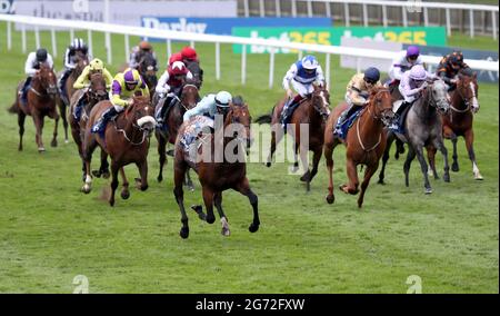 Starman ridden by jockey Tom Marquand on their way to winning the ...