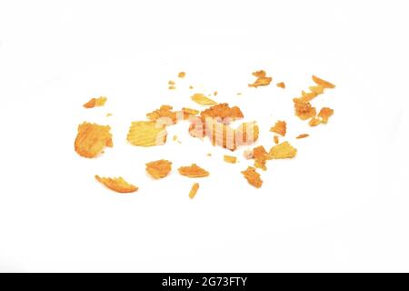Potato chips crumbs and leftovers isolated over the white background ...