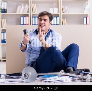 Businessman frustrated at many telephone calls Stock Photo - Alamy