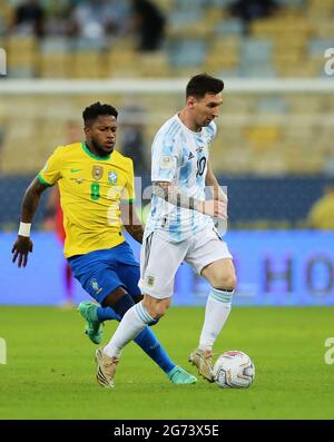 Lionel Messi of Argentina and Fred of Brazil During match between ...