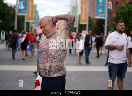 An England fan shows off his tattoos outside the ground ahead of the ...