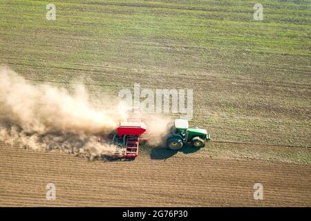 A top view of a green tractor cultivating a field Stock Photo - Alamy