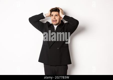 Image of anxious businessman start to panic, looking left with worried ...