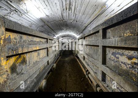 Underground mine railway for transporting ore. Freight trolleys and ...
