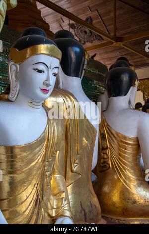Yangon, Myanmar - January 2020: Golden Buddha statues, Shwedagon Pagoda ...