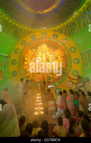 KOLKATA , INDIA - OCTOBER 1, 2014 : Priest praying to Goddesss Durga ...