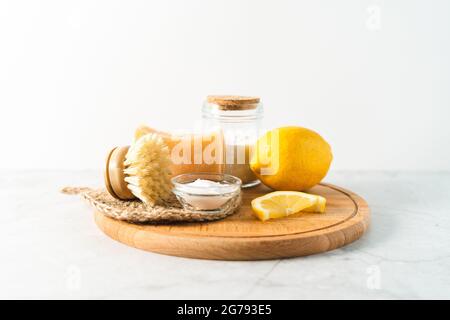 Eco friendly natural cleaners, jar with baking soda, dish brush, lemon ...