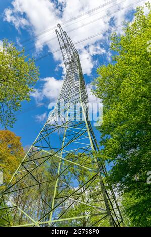 Overhead line mast, high-voltage line crosses the agricultural ...