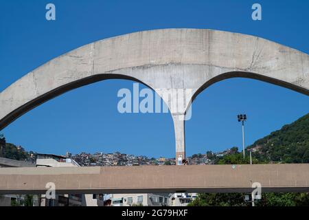 Reinforced concrete pedestrian bridge with the Rocinha favela in the ...