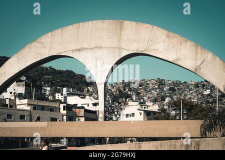 Reinforced concrete pedestrian bridge with the Rocinha favela in the ...