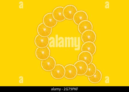 Sliced orange alphabet - letter Q. Isolated white background. Fresh ...