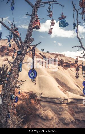 Evil eye amulets on a tree near Goreme town in Cappadocia, Turkey Stock ...