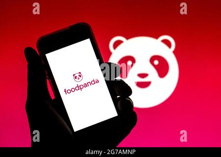 In this photo illustration the Foodpanda logo seen displayed on a ...