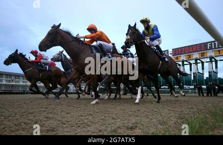 Runners and riders leave the starting gates in the Texas At Sandown ...