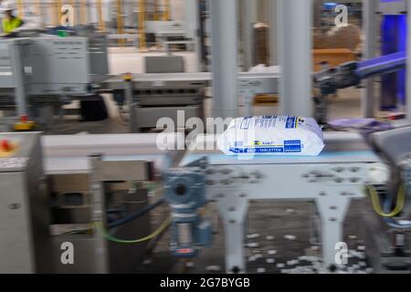12 July 2021, Saxony-Anhalt, Staßfurt: An employee of the chemical ...