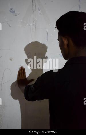 A man and his shadow . Concept -loneliness and depression Stock Photo ...