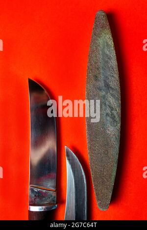 Two knives on red Stock Photo - Alamy