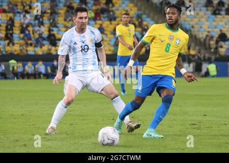 Lionel Messi of Argentina and Fred of Brazil During match between ...