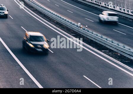 Fast moving blurry cars driving on the highway. European highway ...