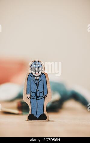 A selective focus shot of a mini toy stage with little figures ...