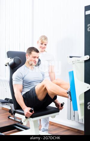 Leg Exercises - Man Doing Leg With Machine In Gym Stock Photo - Alamy