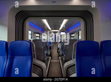 Interior of a modern equipped train on the rails in the daylight Stock ...