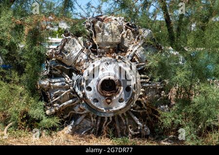 Old damaged aircraft radial engine showing air cooled cylinder, piston ...