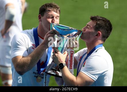England’s Tom Roebuck and Raffi Quirke pose with the trophy after ...