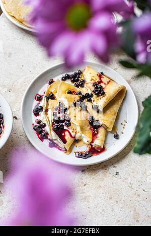 Wild Blueberry Crepes with purple flowers Stock Photo - Alamy