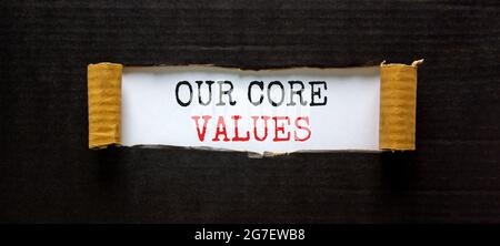 Our core values symbol. Words 'Our core values' appearing behind torn ...