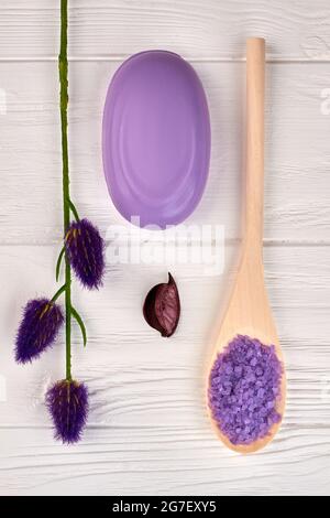 Vertical shot purple bath accessories on white desk Stock Photo - Alamy